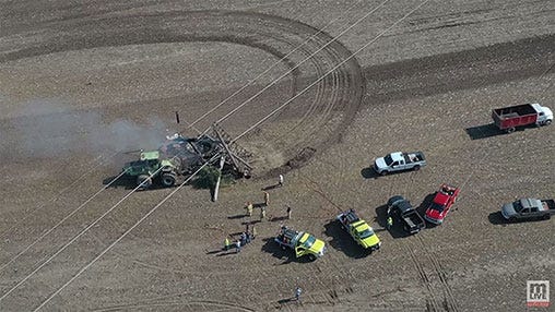 Powerlines laying across tractor – what do you do now? - Michigan Farm News